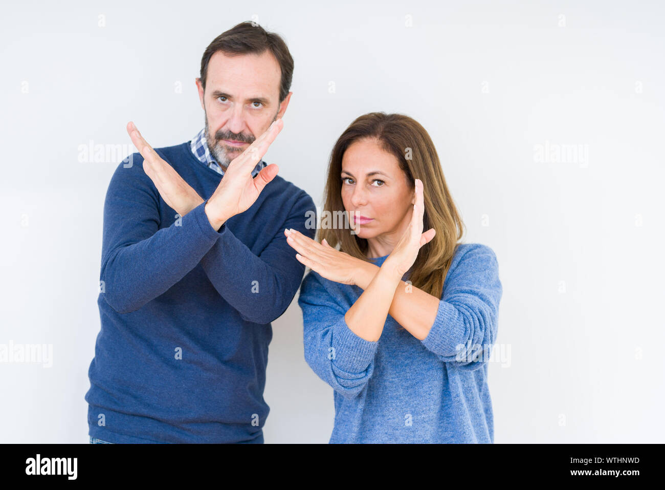 Beautiful middle age couple in love over isolated background Rejection ...
