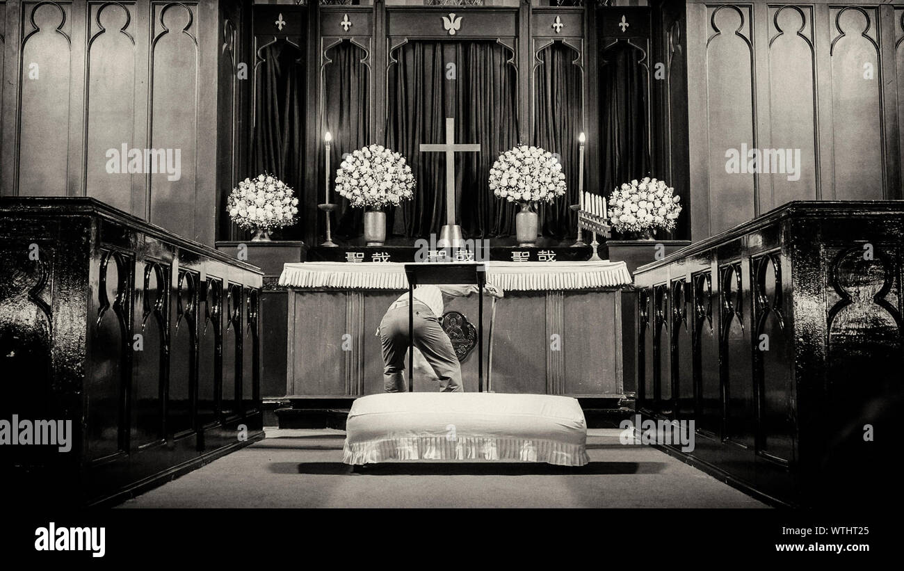 Praying at altar hi-res stock photography and images - Alamy