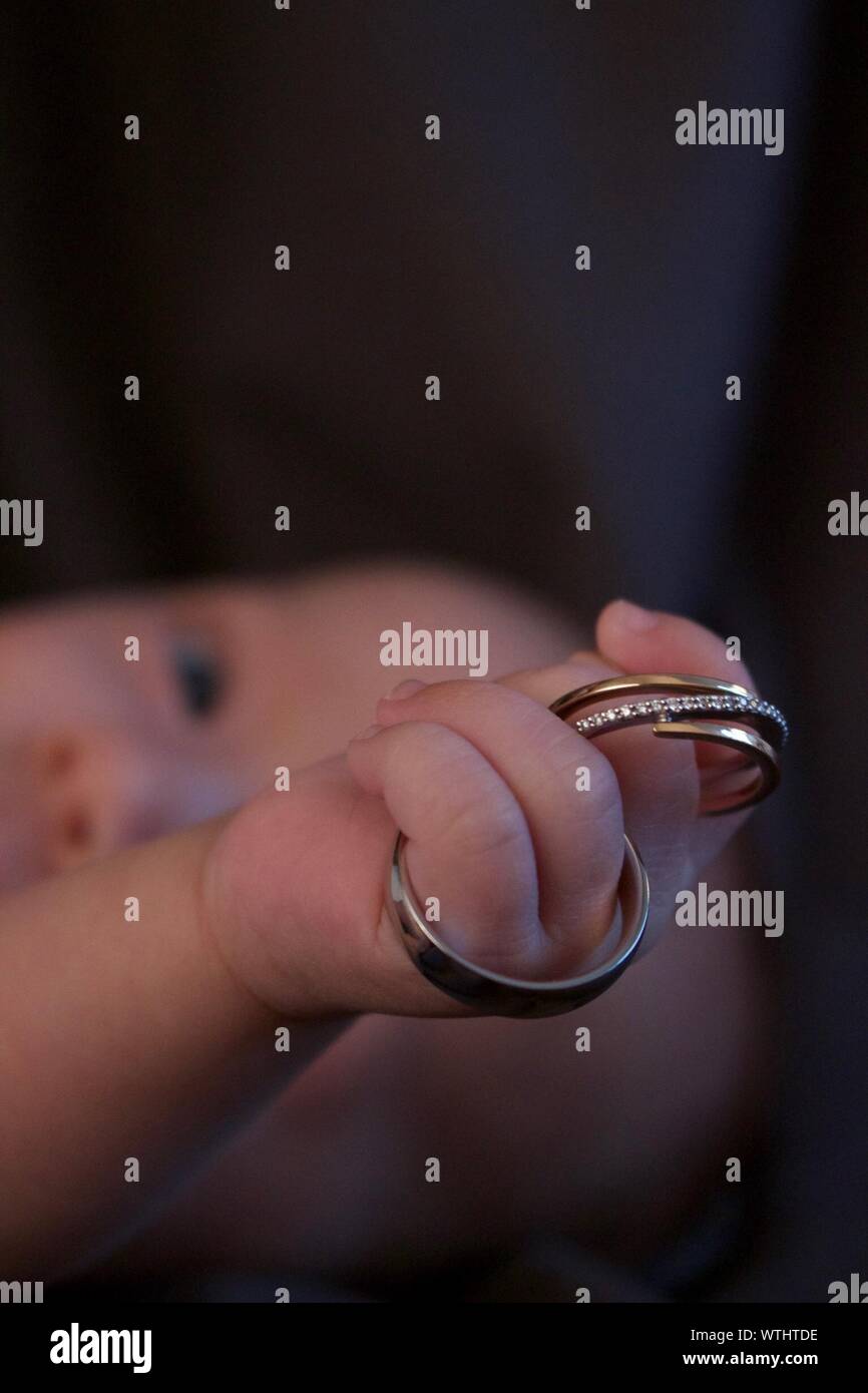 Baby hand holding finger ring hi-res stock photography and images - Alamy