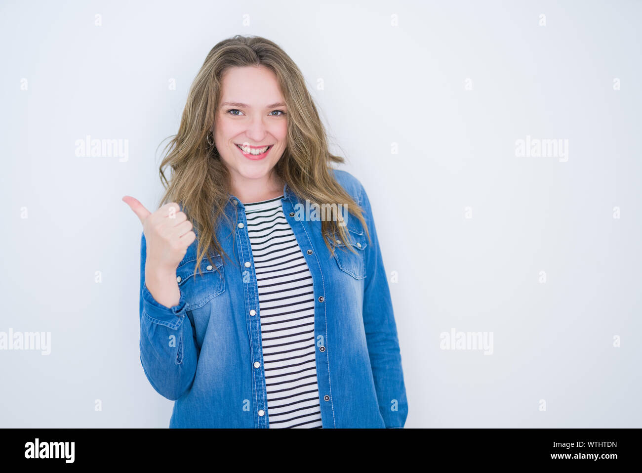 Beautiful blonde girl with blue eyes over white isolated background ...