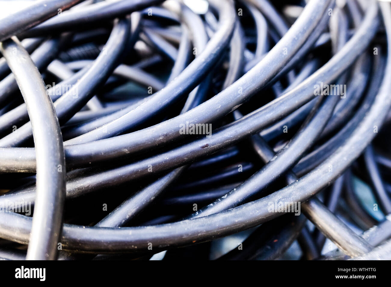 Roll of black electric cable Stock Photo - Alamy