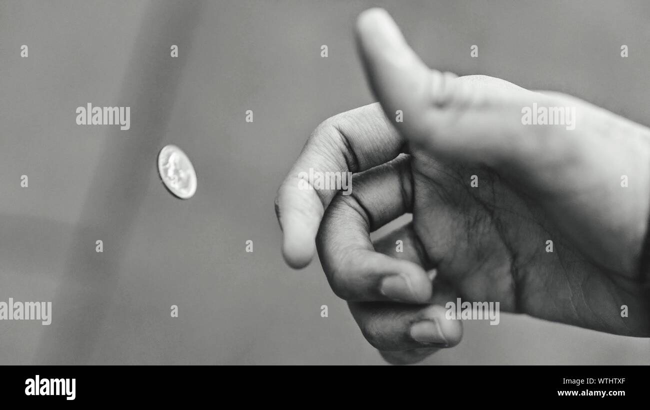 Man flipping coin hi-res stock photography and images - Alamy