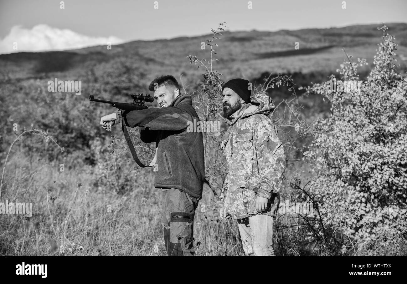 Hunters poachers looking for victim. Poachers with rifles in nature ...