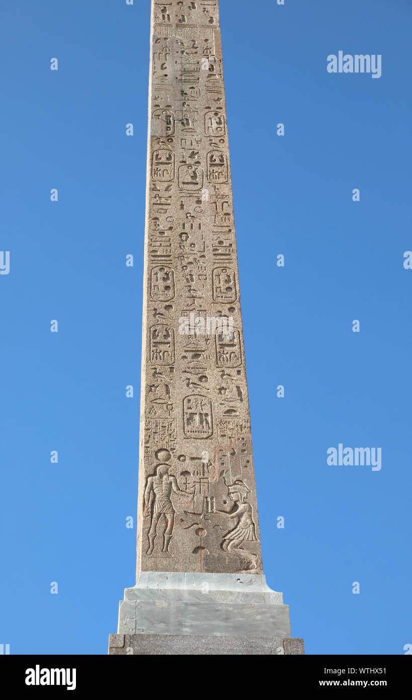 Old Egyptian Obelisk with hieroglyphs and blue sky on background Stock ...