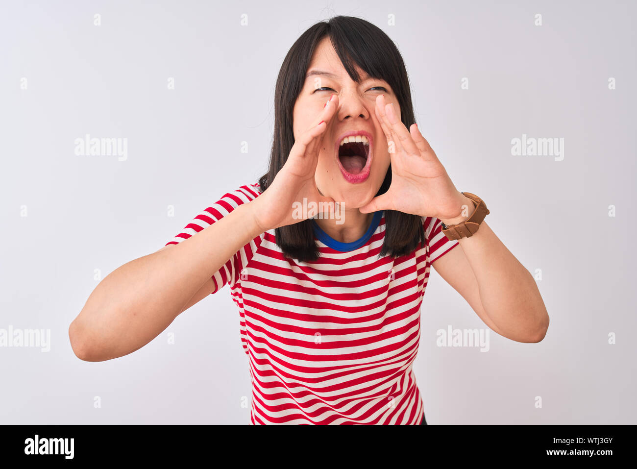 Young beautiful chinese woman wearing red striped t-shirt over isolated ...