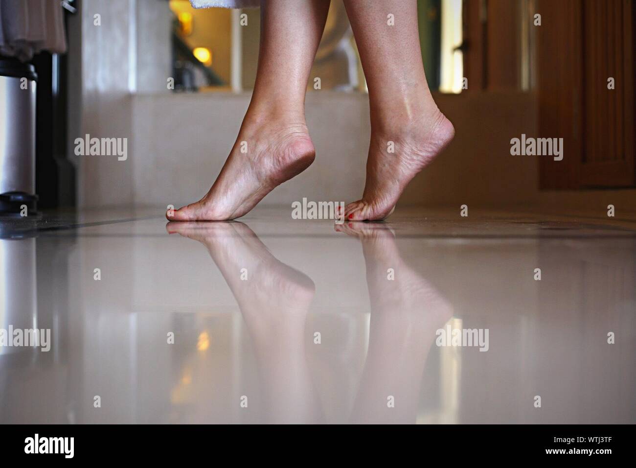 Woman tiptoeing hi-res stock photography and images - Alamy