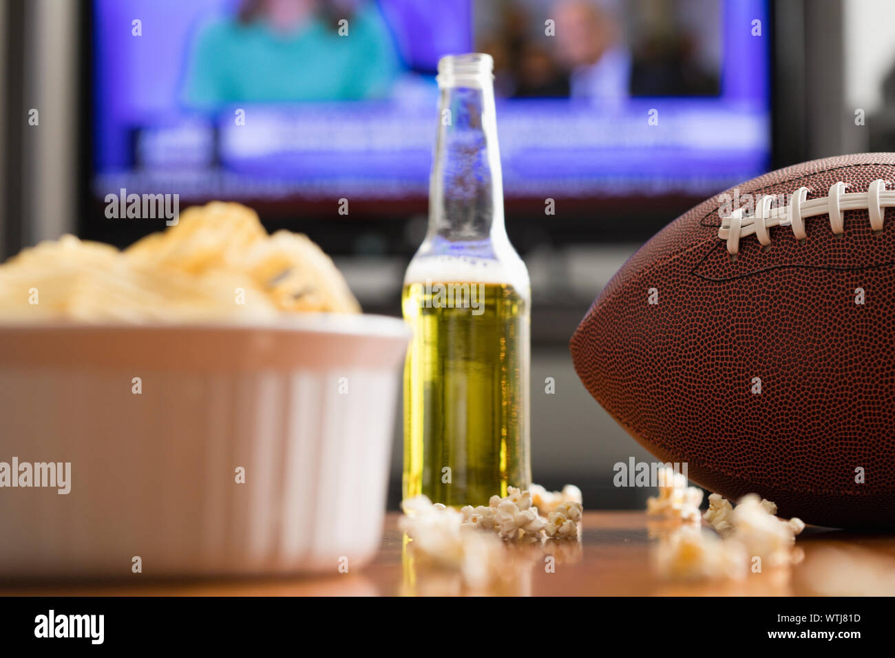 Football with beer and popcorn on table Stock Photo - Alamy