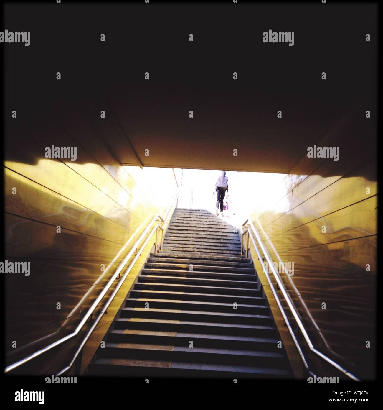 Rear view climbing stairs hi-res stock photography and images - Alamy