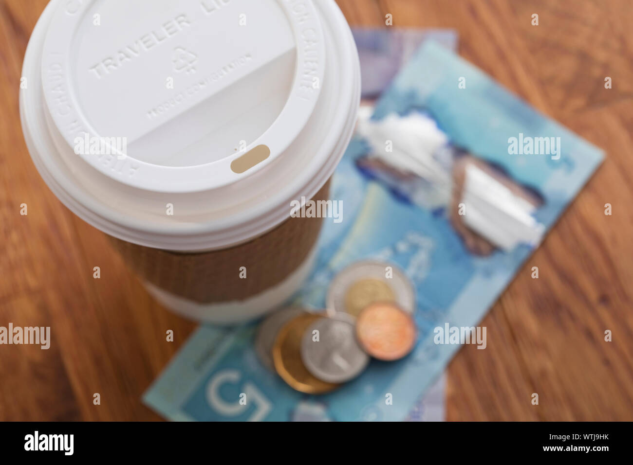 Coffee to go with cash money Stock Photo - Alamy