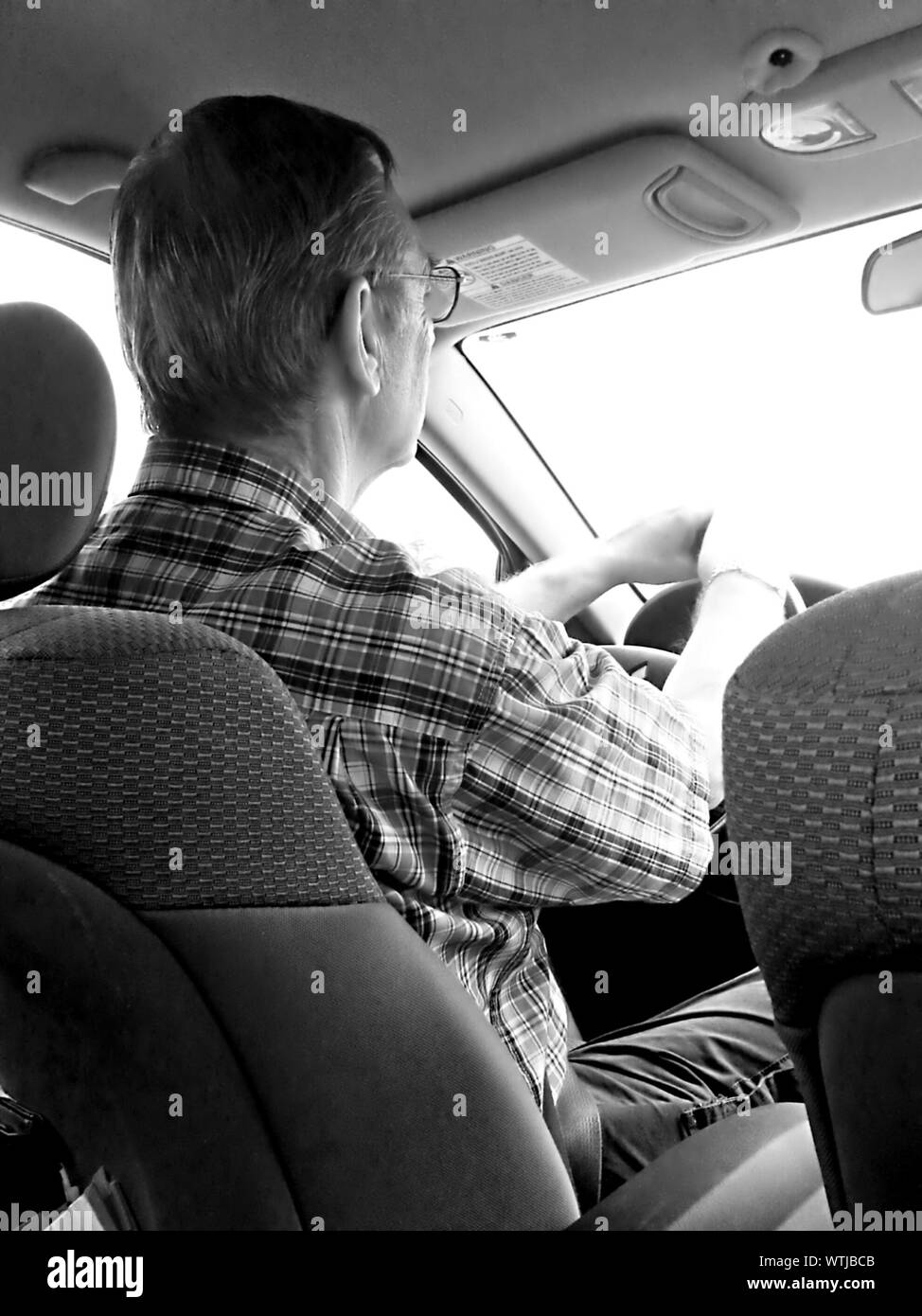 Person driving car Black and White Stock Photos & Images - Alamy