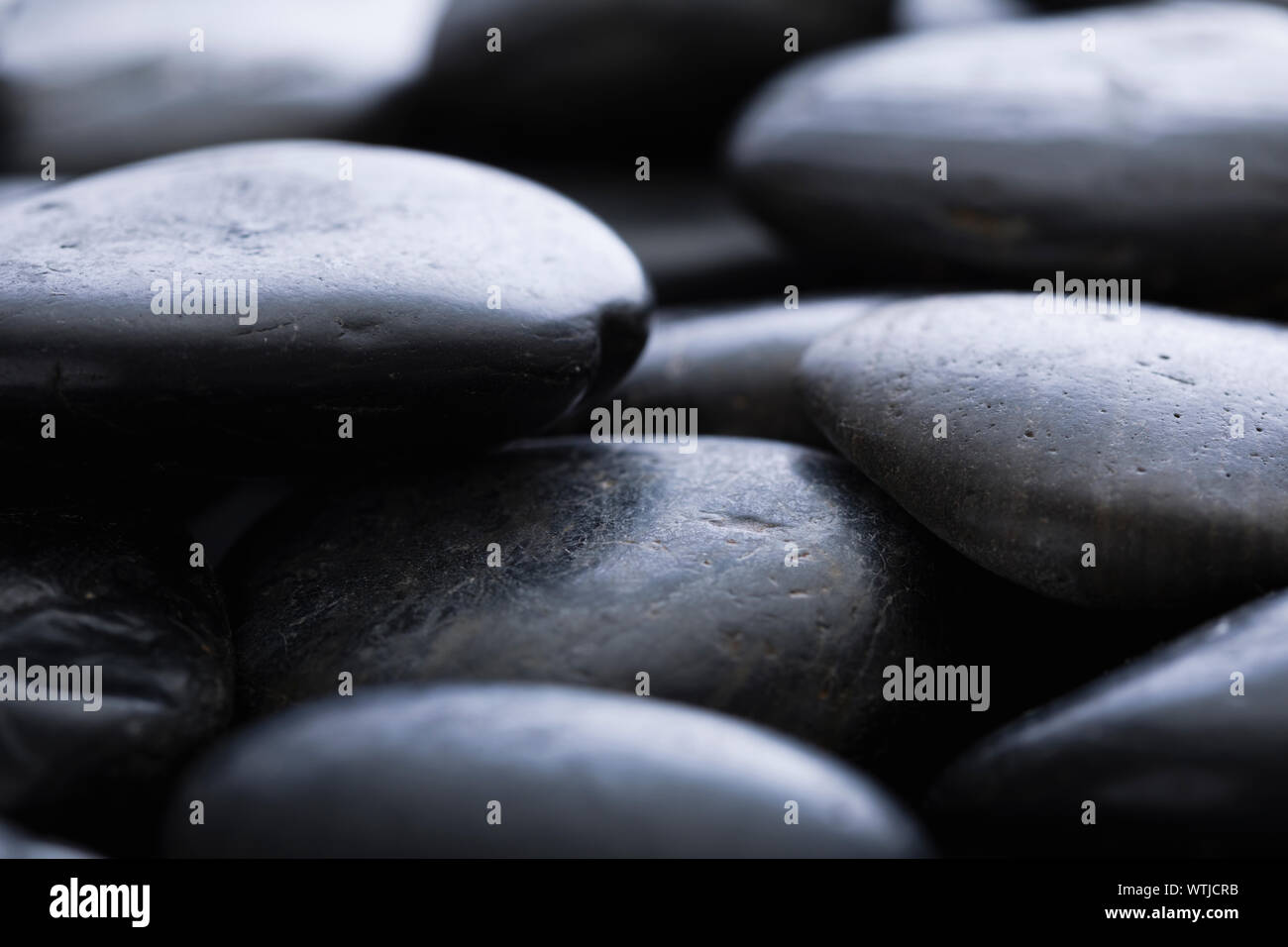 Black round rock hi-res stock photography and images - Alamy
