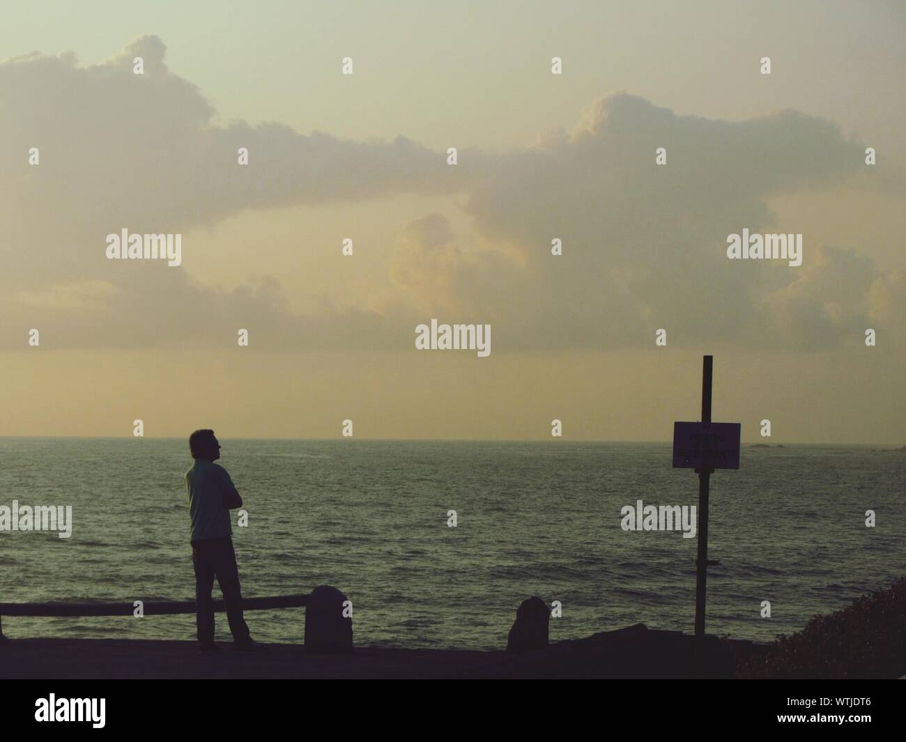 Man looking out over water hi-res stock photography and images - Alamy