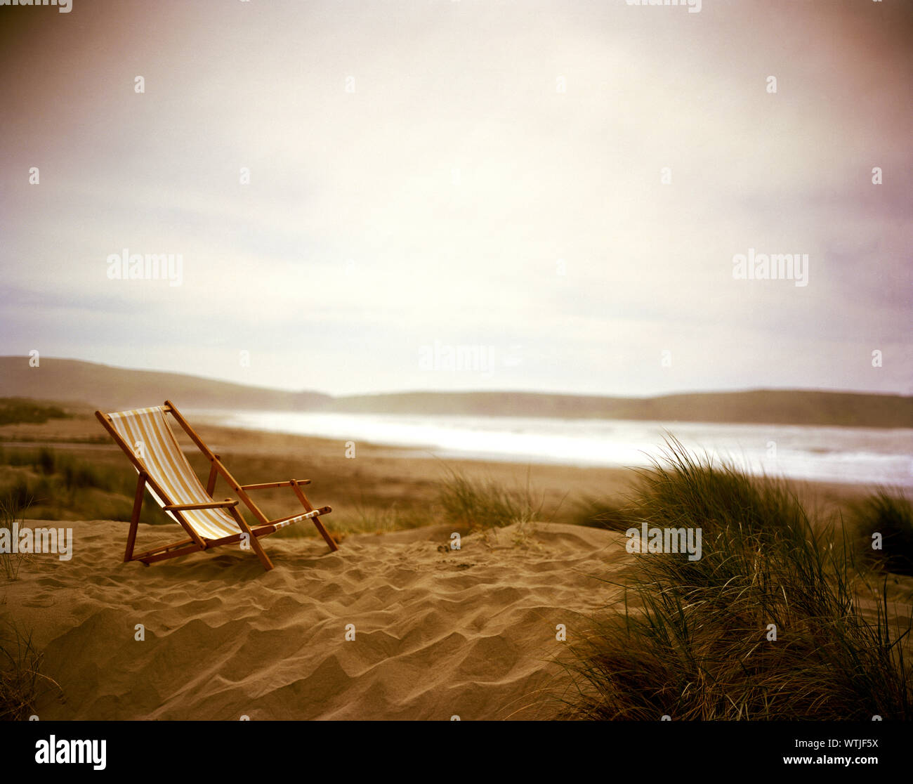 Empty deck chair on the beach Stock Photo - Alamy
