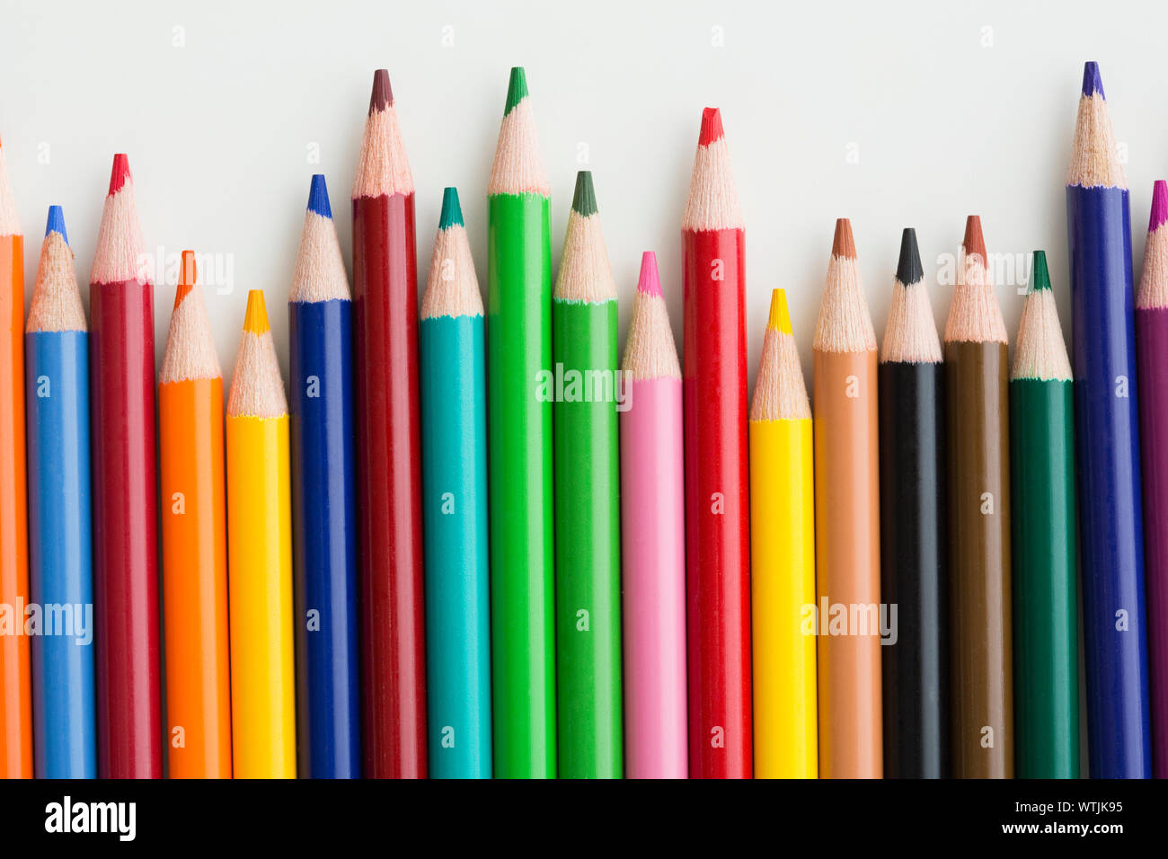 Colored pencils in a row Stock Photo - Alamy