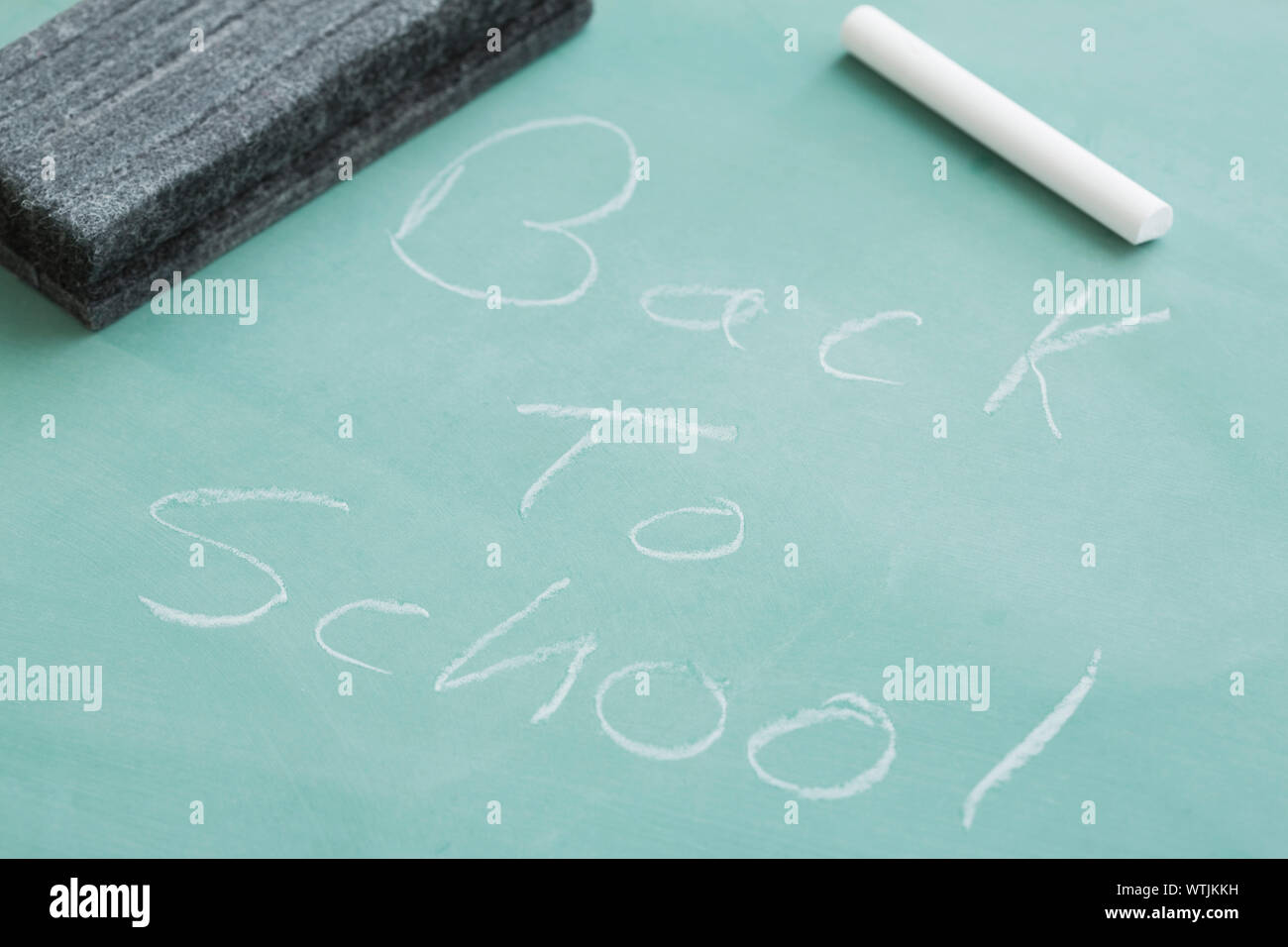 Back to school written with chalk on blackboard Stock Photo - Alamy