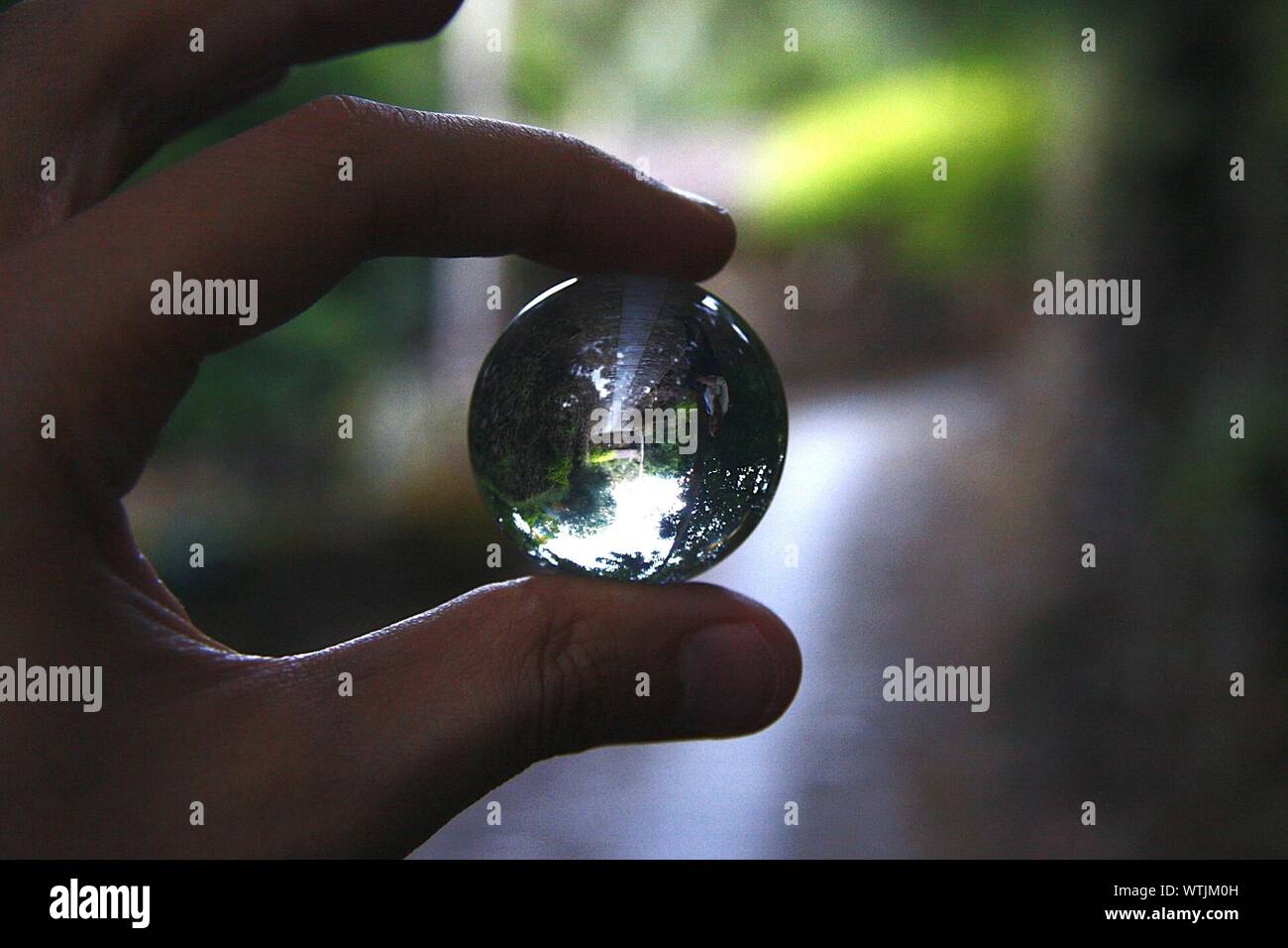 Hand Holding Marbles High Resolution Stock Photography and Images - Alamy