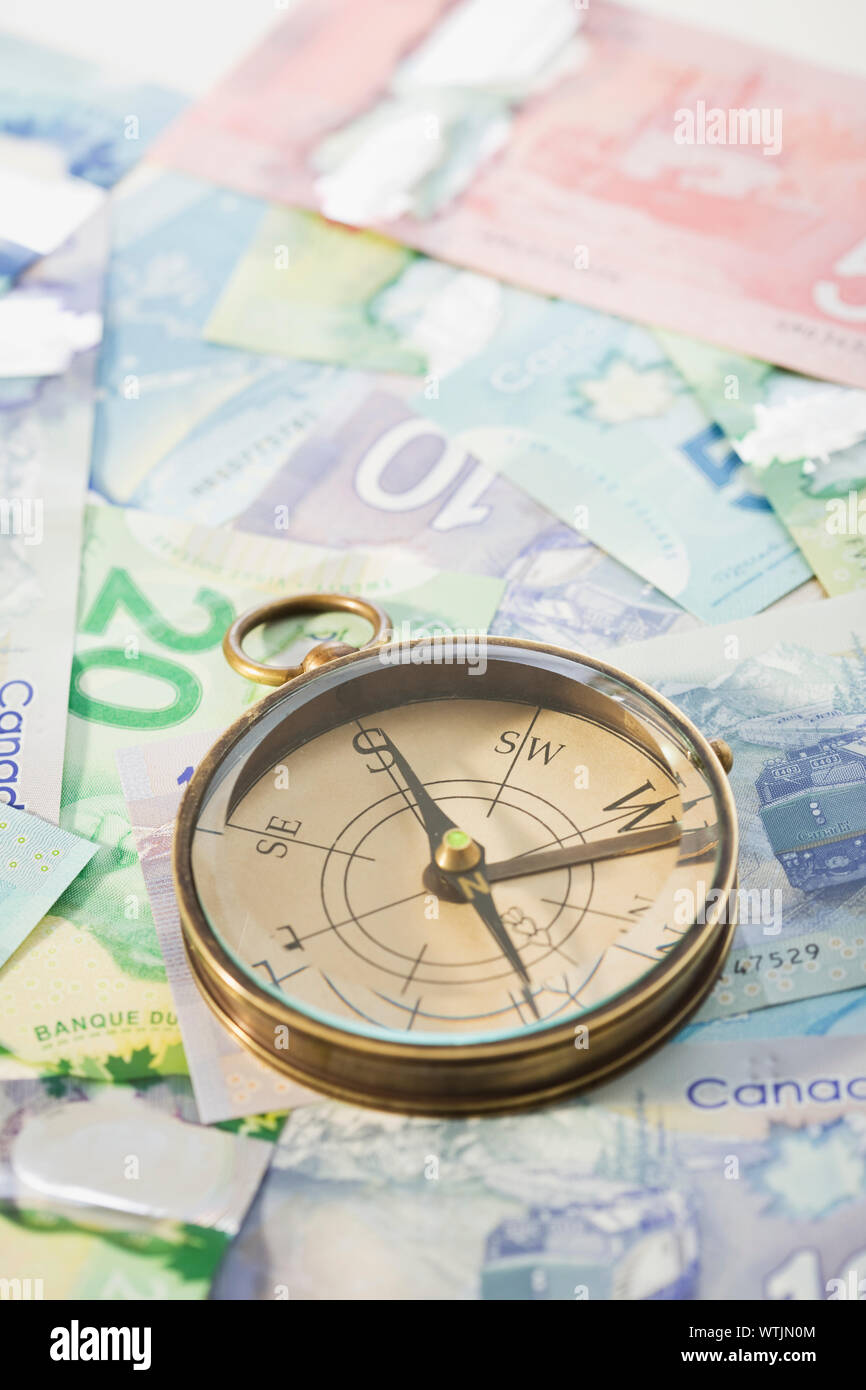 Close up of Canadian paper currency and compass Stock Photo - Alamy