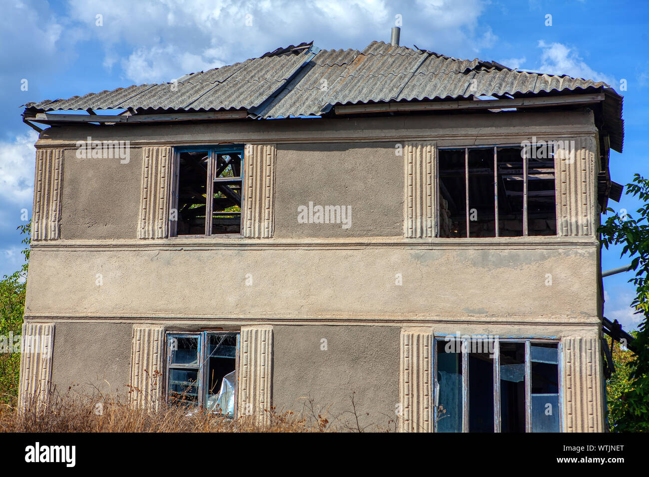 abandoned big house in village Stock Photo - Alamy