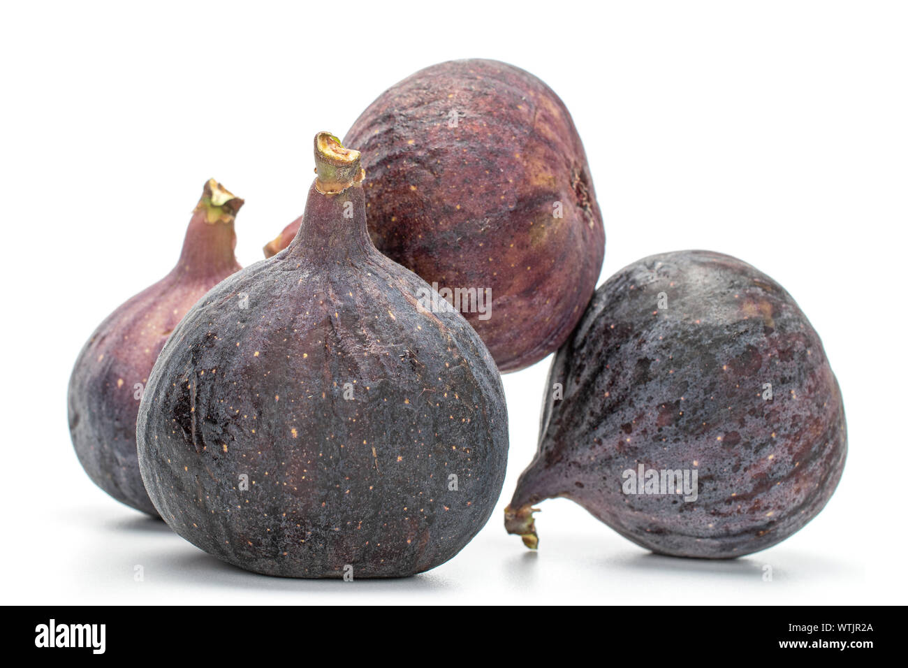 Group of four whole fresh fig fruit isolated on white background Stock ...