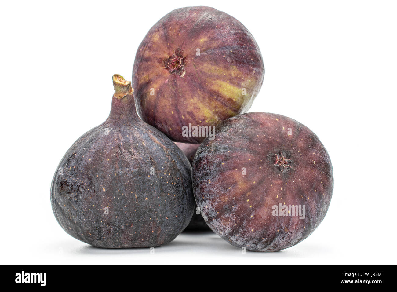 Group of four whole fresh fig fruit heap isolated on white background ...