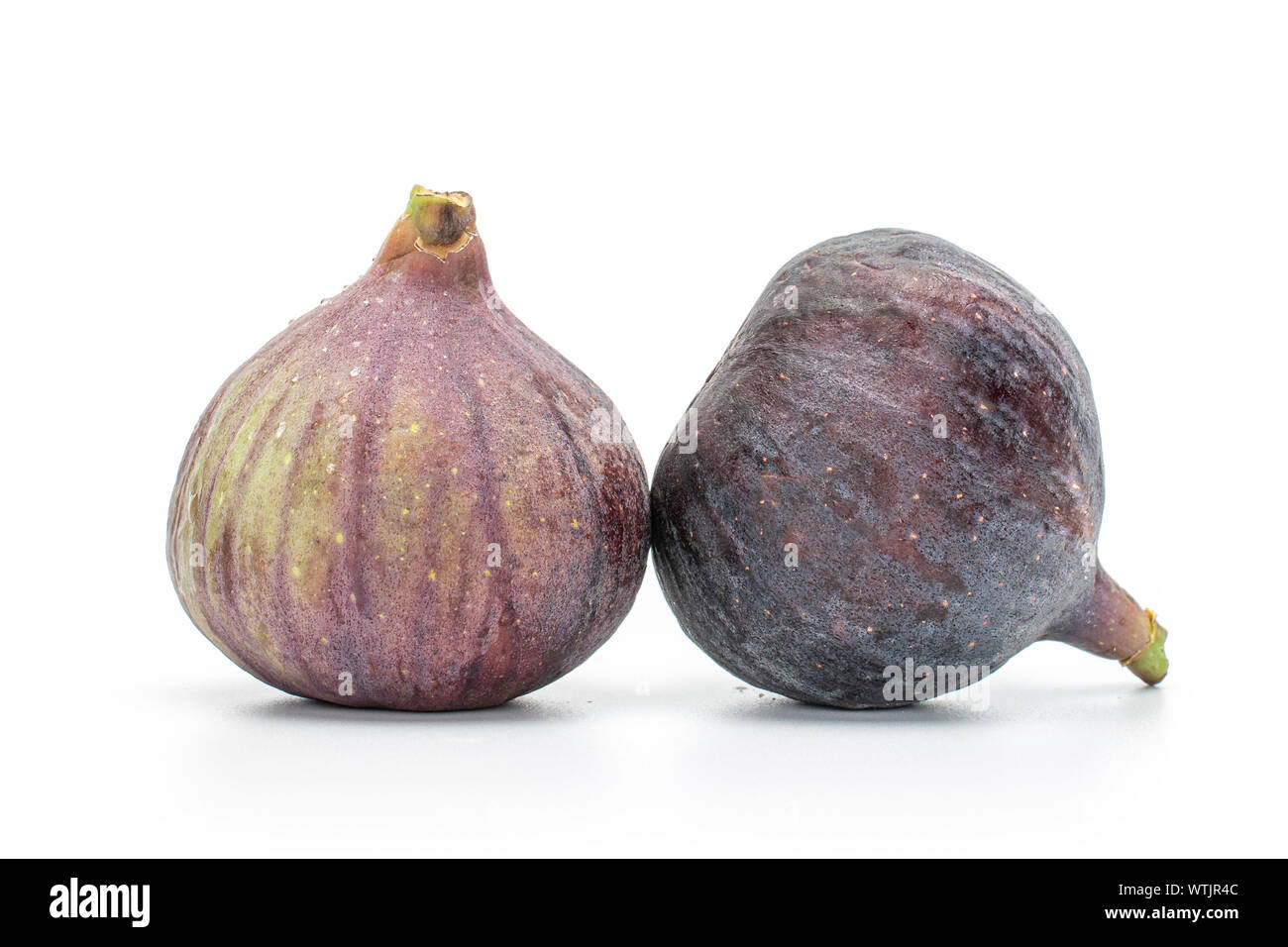 Group of two whole fresh fig fruit isolated on white background Stock ...