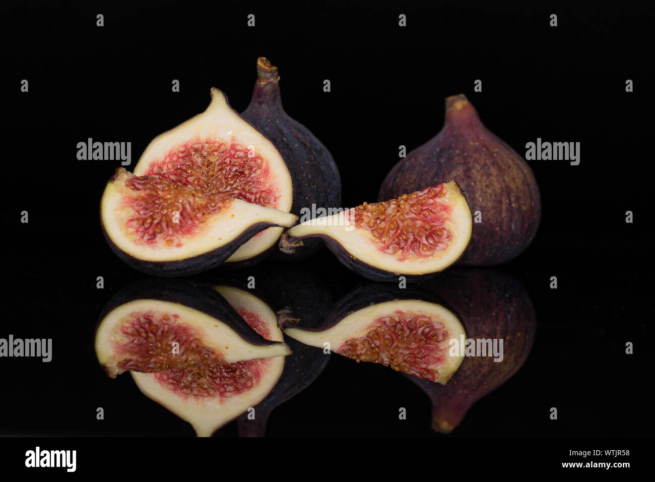 Group of two whole one half two slices of fresh fig fruit isolated on ...