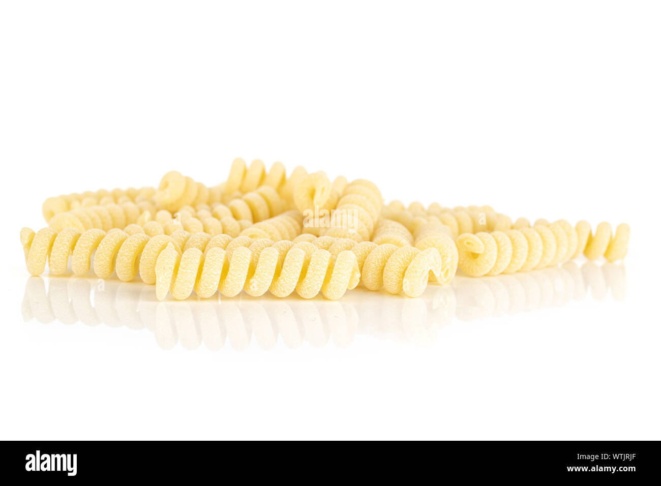 Lot of whole fresh raw pasta fusilli bucati isolated on white ...