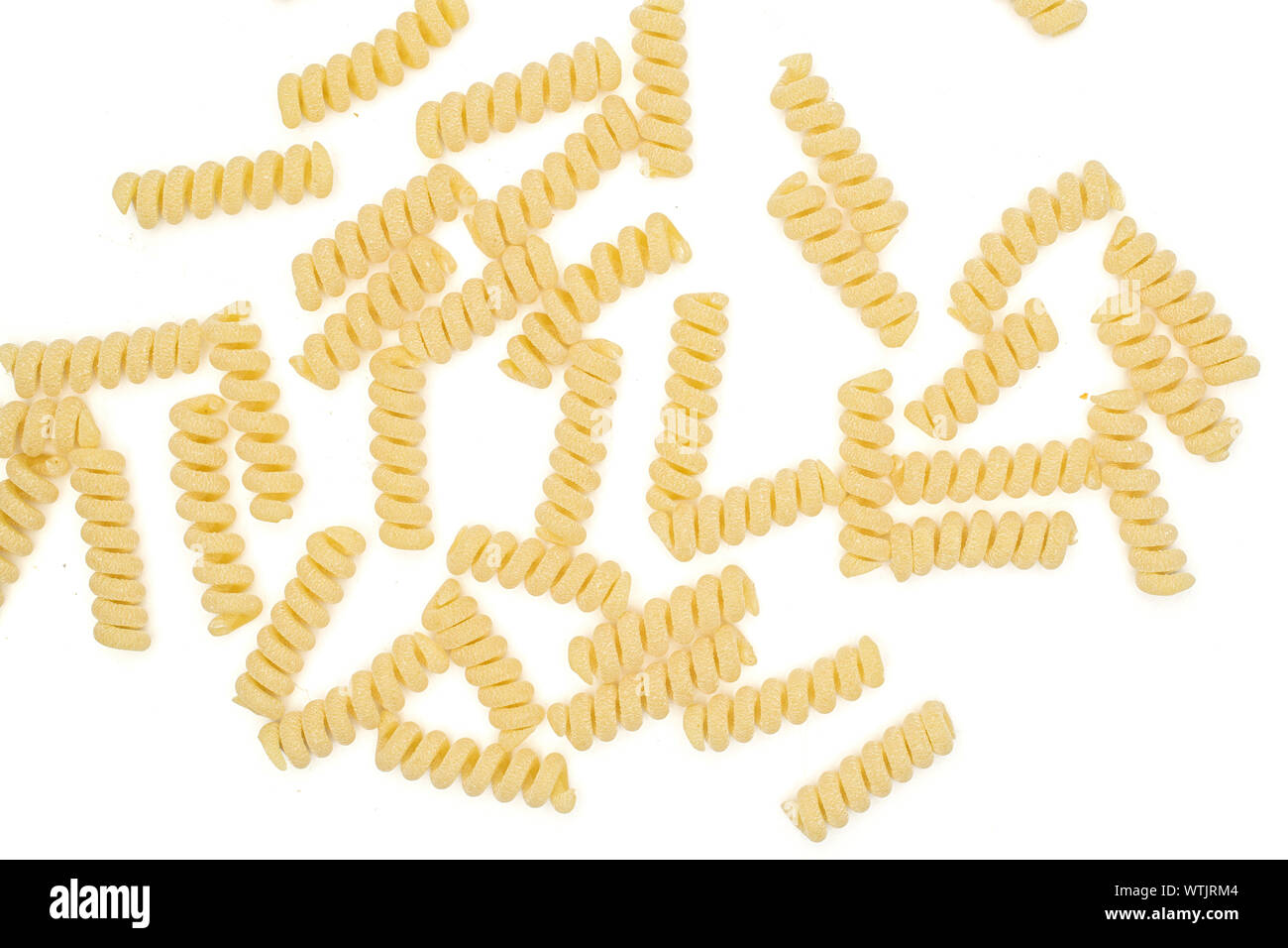 Lot of whole fresh raw pasta fusilli bucati flatlay isolated on white ...