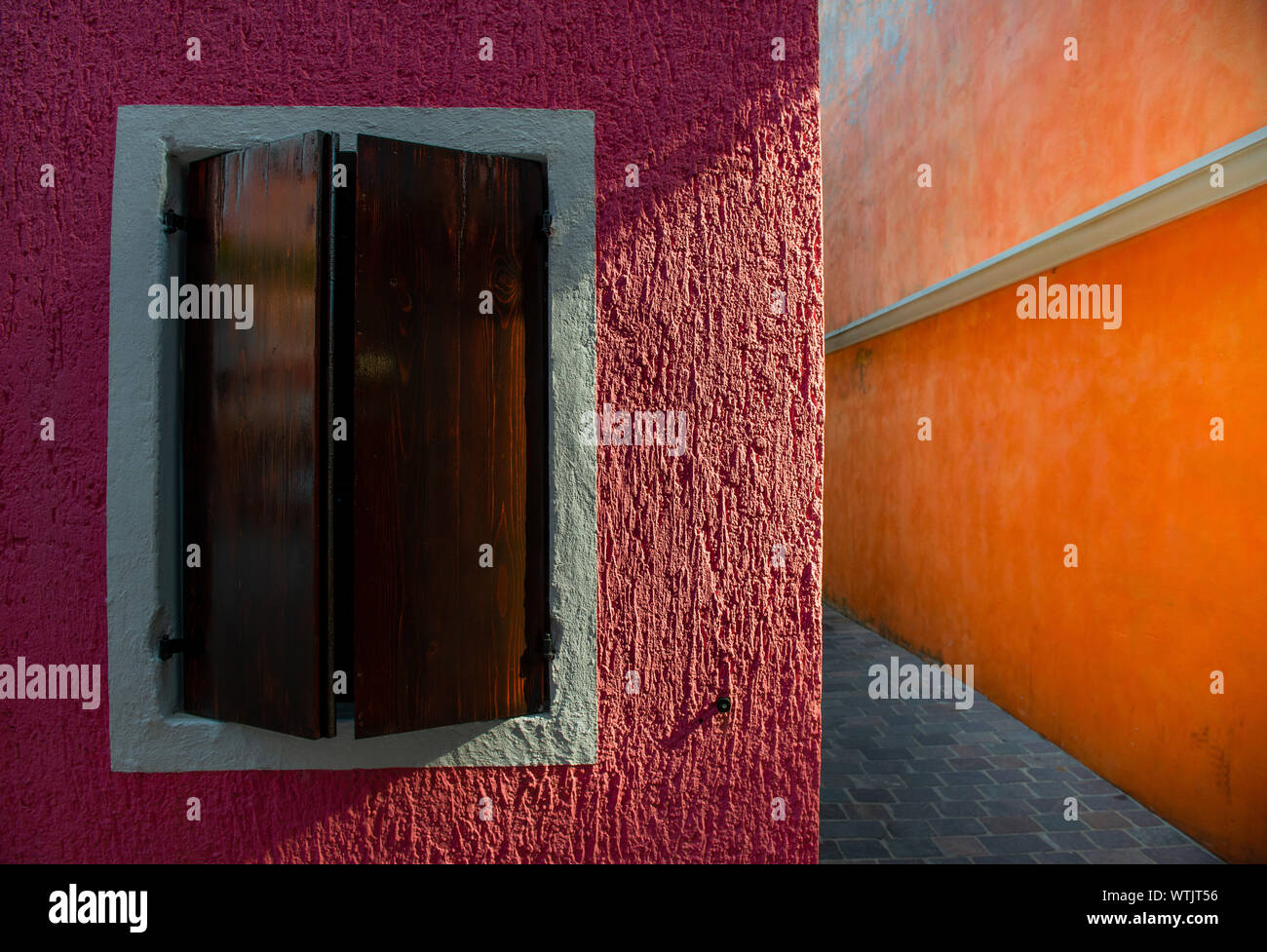 Brown window with a beam of light illuminating the wall Stock Photo - Alamy