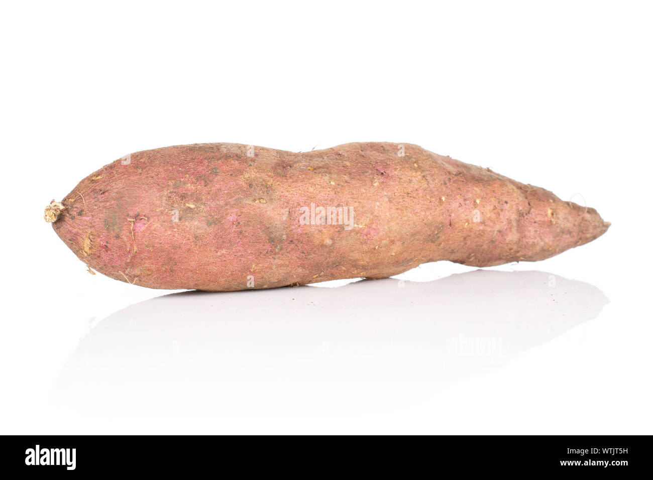 One whole fresh brown sweet potato isolated on white background Stock ...