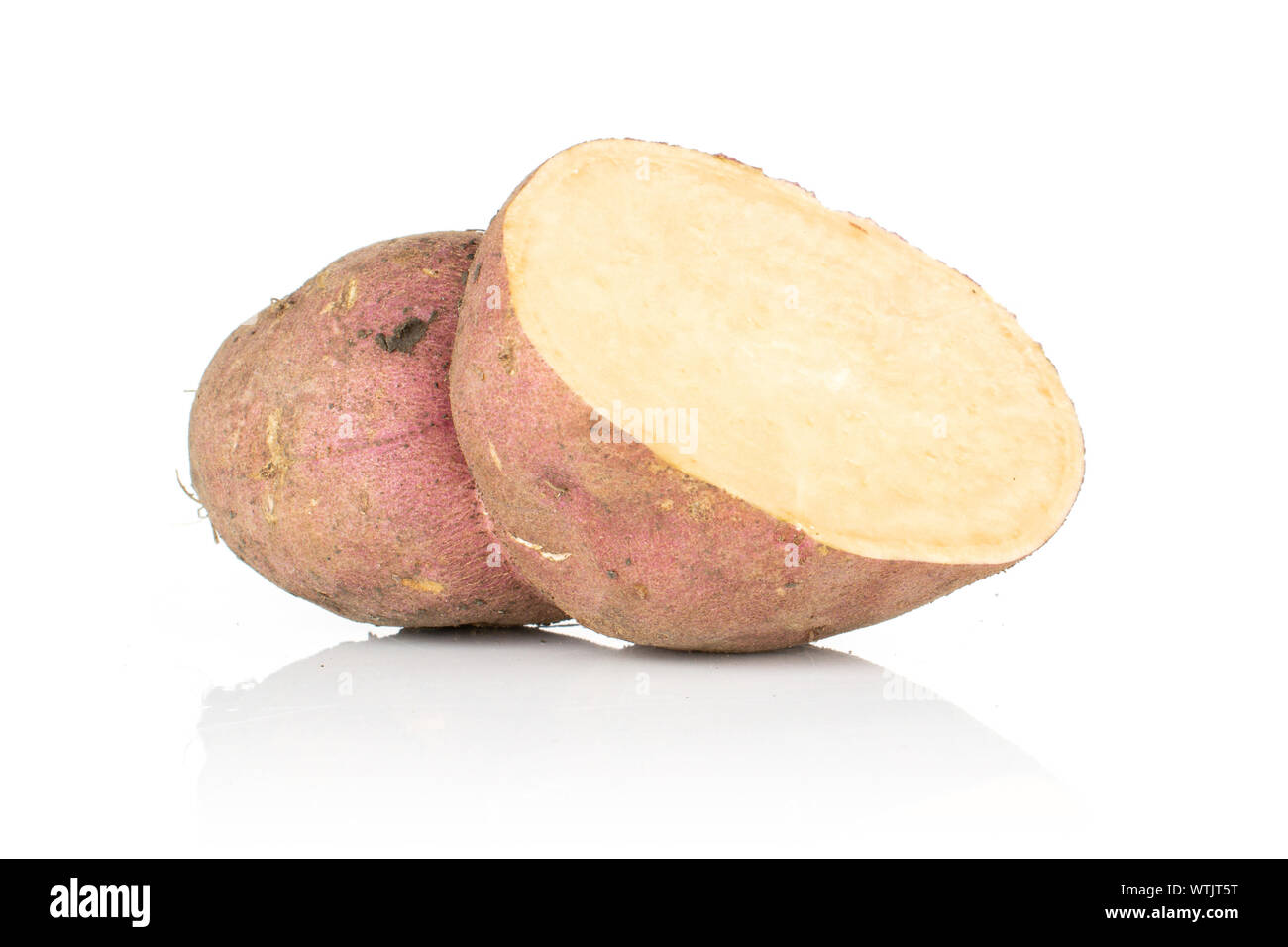 One half of fresh brown sweet potato isolated on white background Stock ...