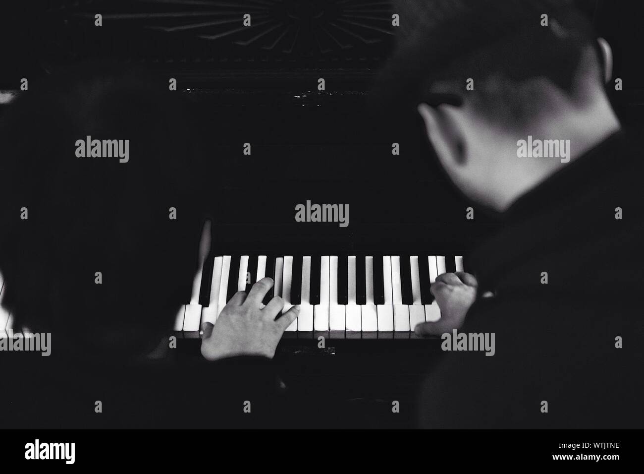 Two Men Playing Piano High Resolution Stock Photography and Images - Alamy