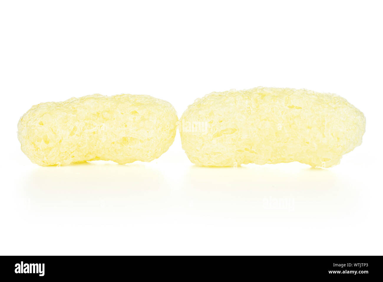 Group of two whole salted yellow corn puff isolated on white background ...