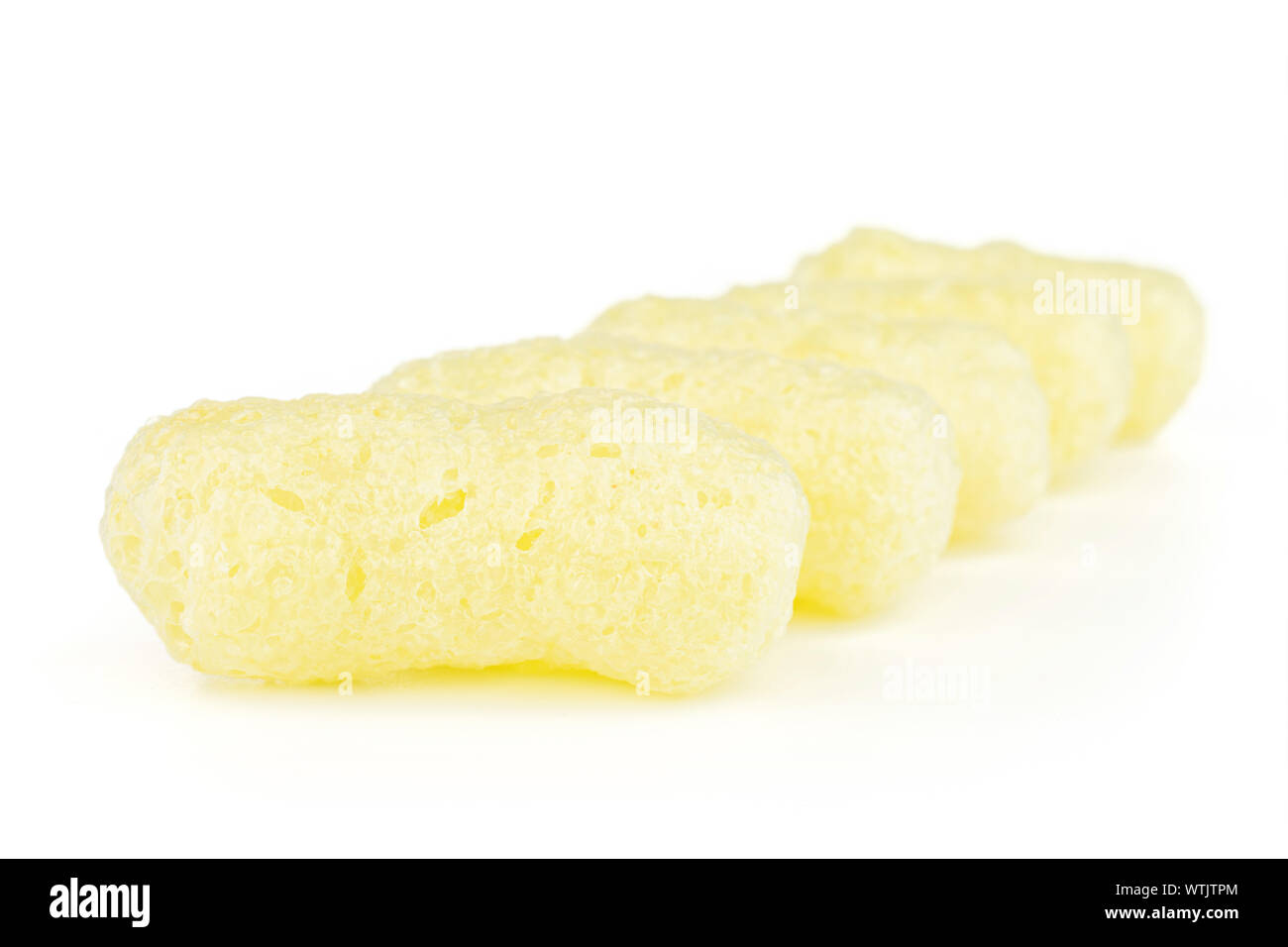 Group of five whole salted yellow corn puff isolated on white ...