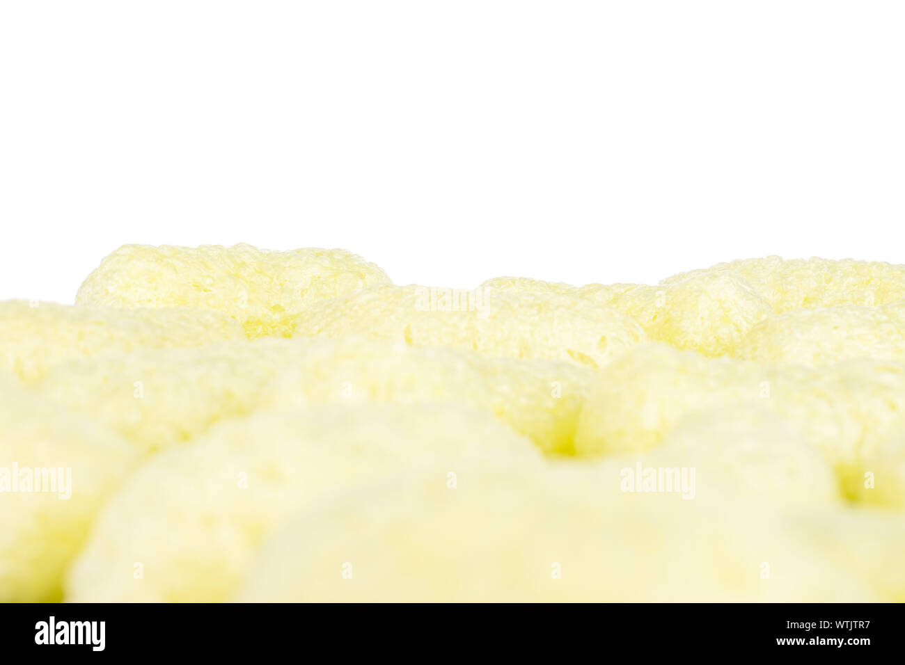 Lot of whole salted yellow corn puff isolated on white background Stock ...