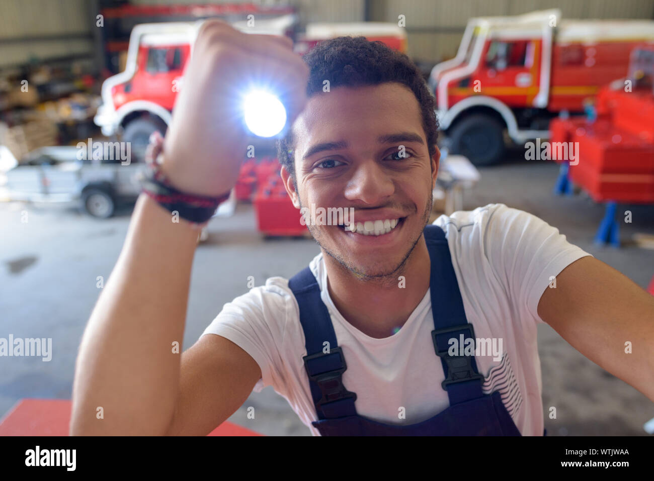mechanic using torch to repair a car Stock Photo - Alamy