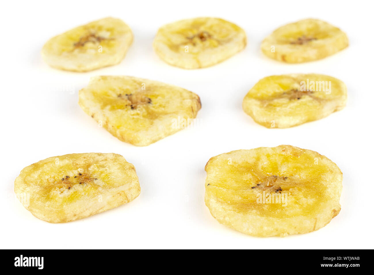 Group of seven slices of sweet yellow dry banana isolated on white ...