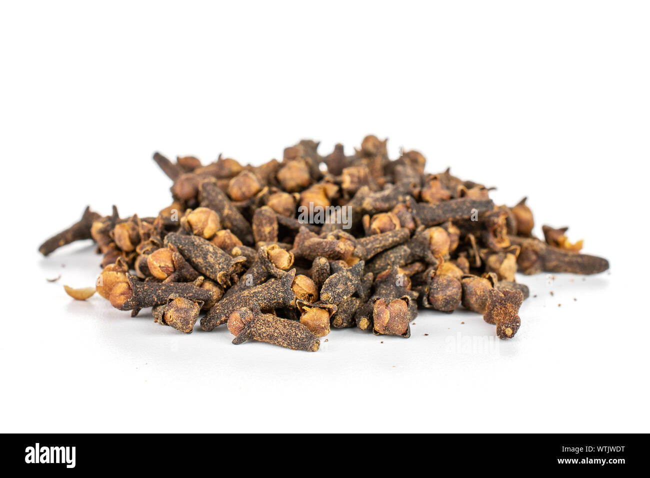 Lot of whole dry brown clove isolated on white background Stock Photo ...