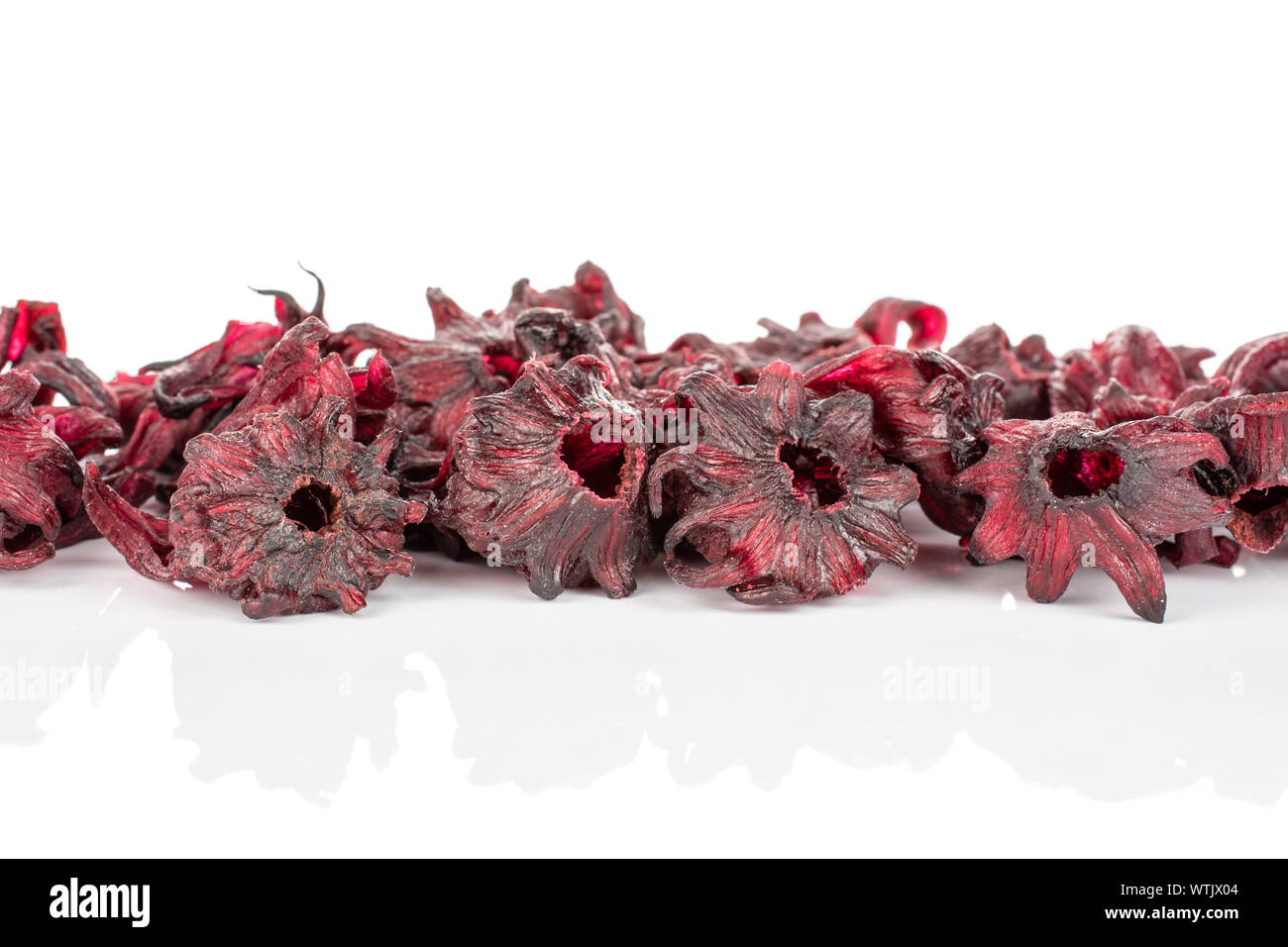 Lot of whole sweet red candied hibiscus in large group isolated on ...