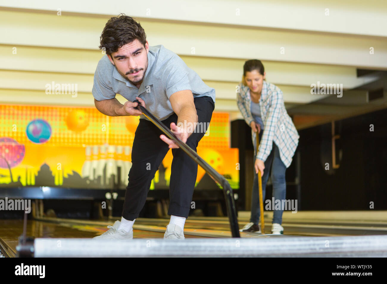 recreational staff cleaning the bowling area Stock Photo - Alamy