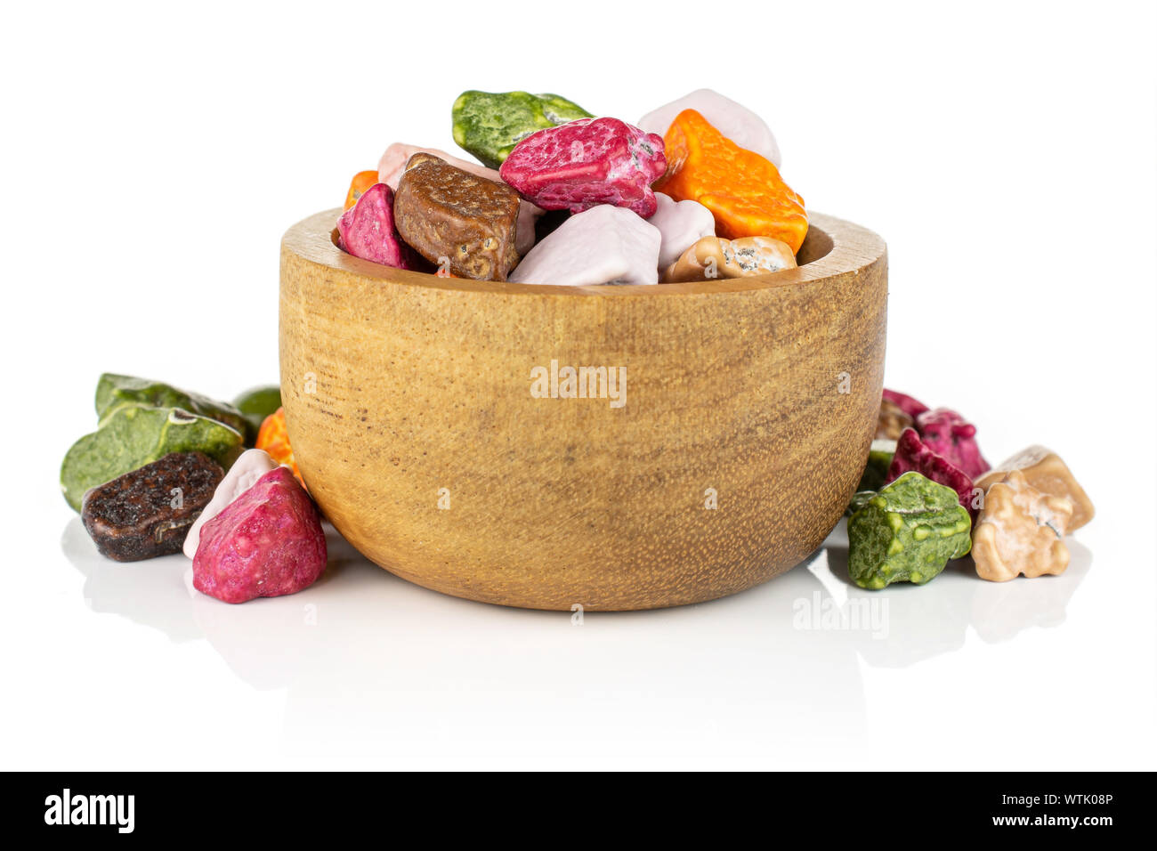 Lot of whole sweet chocolate stone in tiny wooden bowl isolated on ...
