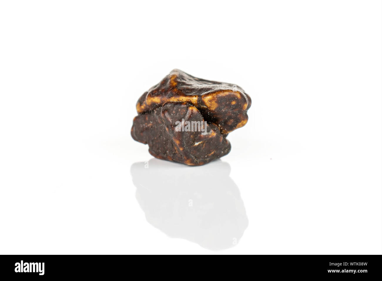 One whole dark brown sweet chocolate stone isolated on white background ...