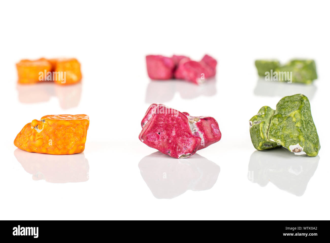 Lot of whole sweet chocolate stone sorted by color isolated on white ...