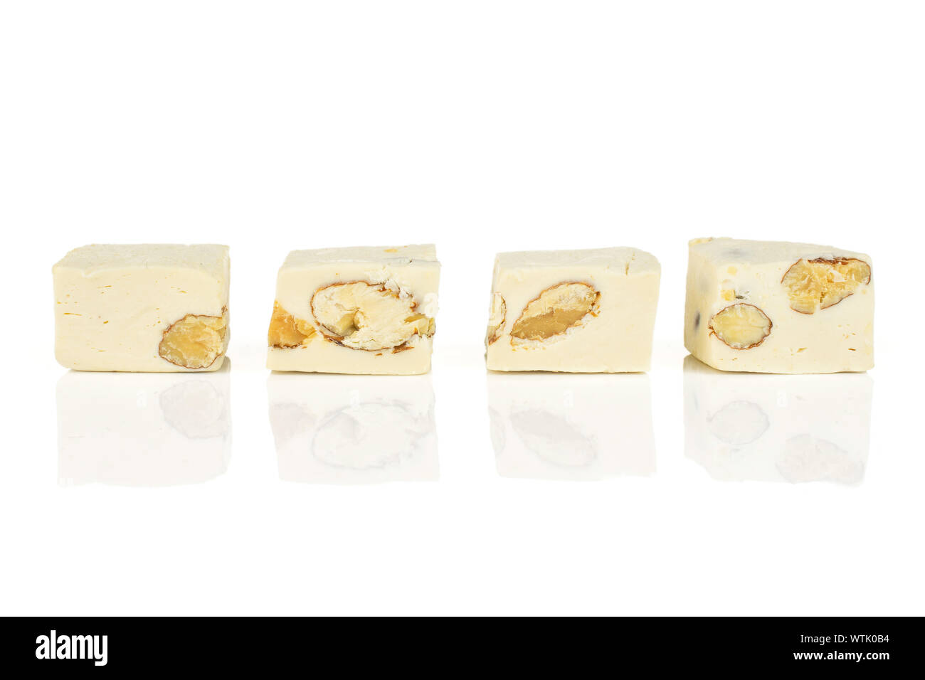 Group of four whole sweet white nougat isolated on white background ...