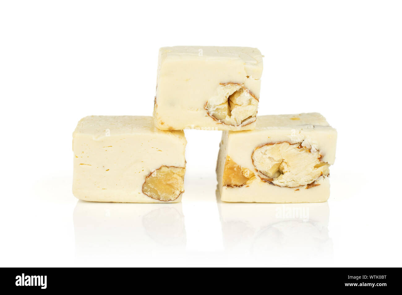 Group of three whole sweet white nougat isolated on white background ...