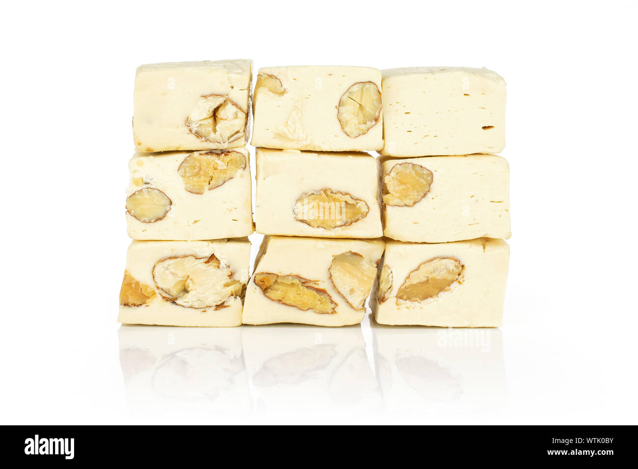 Group of nine whole sweet white nougat isolated on white background ...