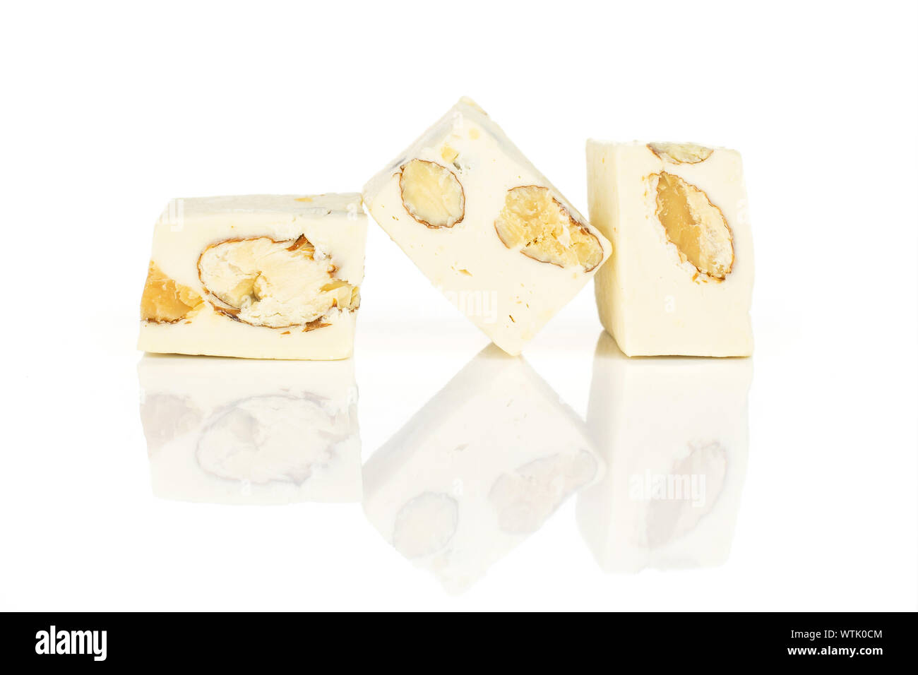 Group of three whole sweet white nougat isolated on white background ...