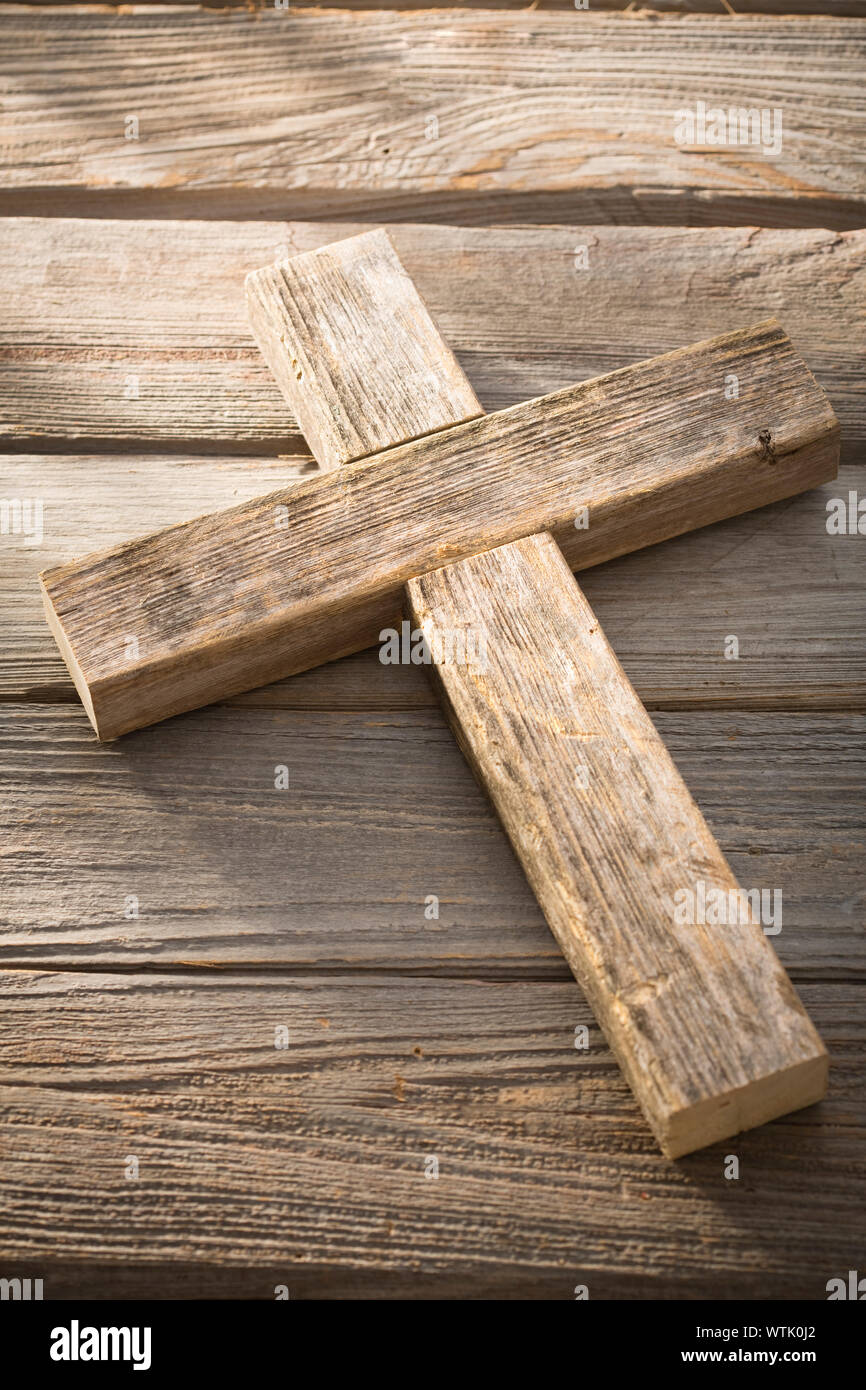 Close-up of wooden cross on wooden background Stock Photo - Alamy