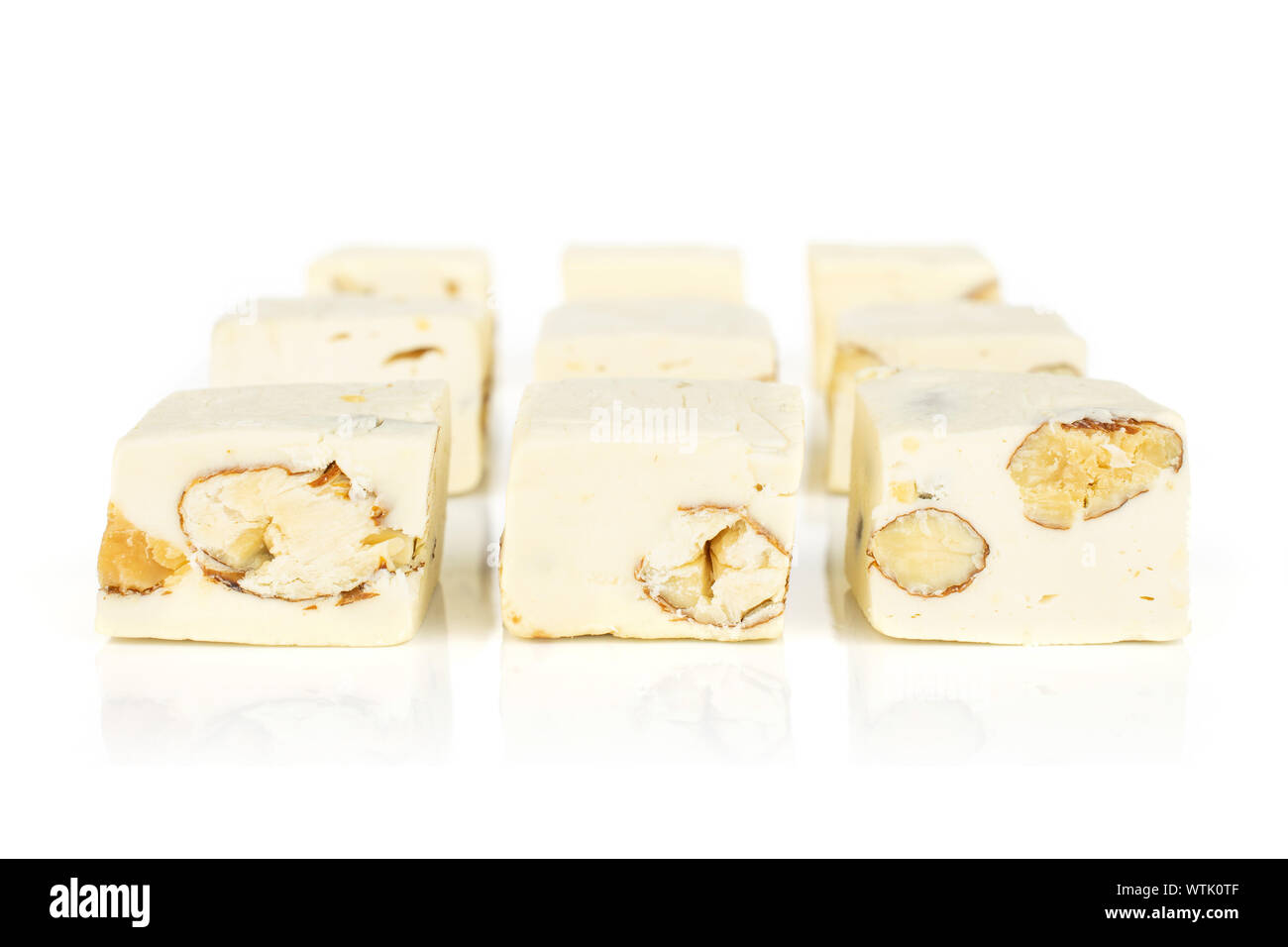 Group of nine whole sweet white nougat isolated on white background ...