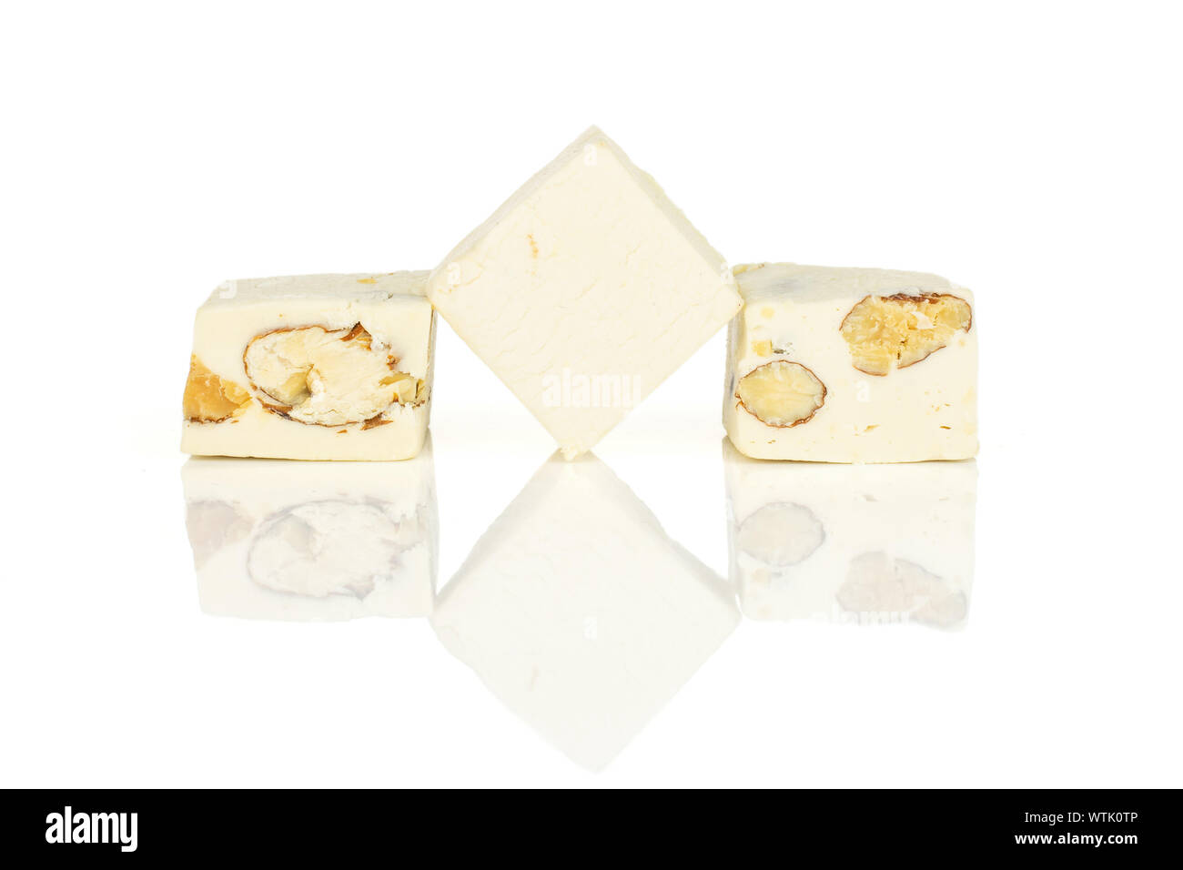 Group of three whole sweet white nougat isolated on white background ...